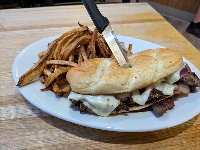 The Philly cheesesteak that doesn't care it's 3,000 miles from Philadelphia. Melted cheese cascading over thinly sliced beef—a sandwich worth the journey.