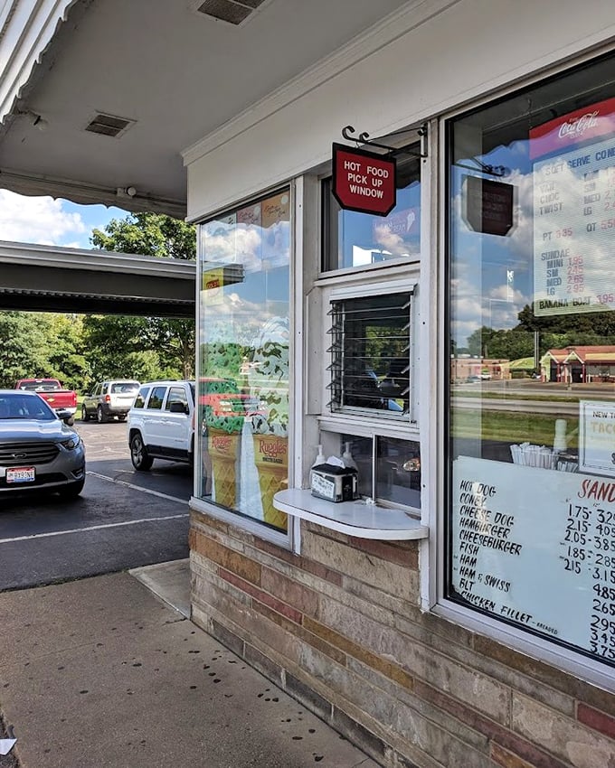 The pick-up window—where summer memories are handed out in paper wrappers and plastic cups, one order at a time.