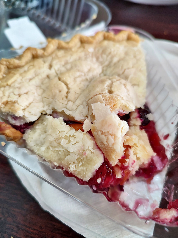 A slice of homemade berry pie that whispers, "Save room for me" throughout your entire meal—and you'll be glad you listened.