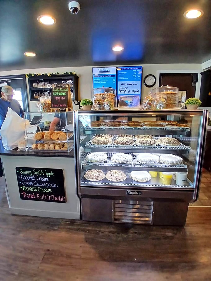 The dessert case—where willpower goes to die and "I'll just have a bite" becomes the lie you tell yourself before ordering whole pies.