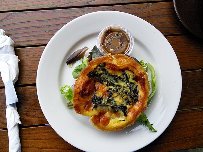 Quiche that's having an identity crisis—is it breakfast? Is it lunch? Who cares when it tastes this good. The flaky crust deserves its own fan club.