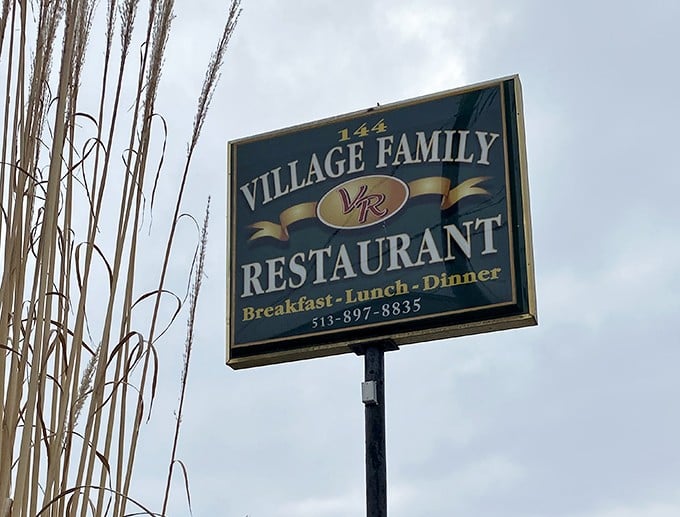 The roadside sign stands as a beacon for hungry travelers – like a lighthouse, but instead of avoiding rocks, you're steering toward rolls.