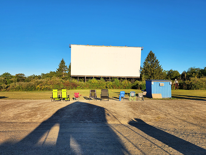 The Mahoning's massive screen awaits the evening's entertainment while early arrivals claim prime viewing spots with colorful chairs.
