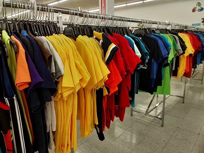 Colorful shirts hang in rainbow formation, making outfit selection a joyful visual experience.