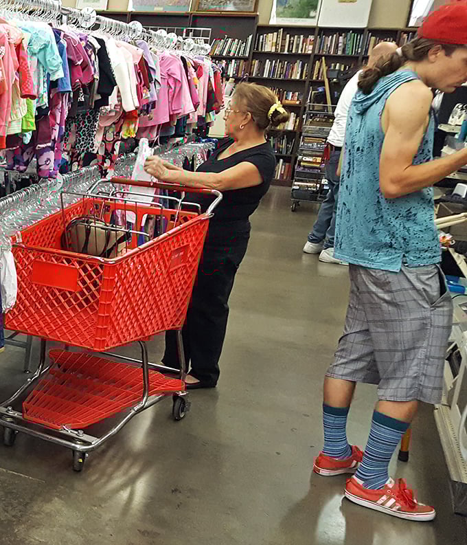 The thrill of the hunt in action! Shoppers navigate the aisles with the focused determination of archaeologists uncovering treasures from a bygone era. 