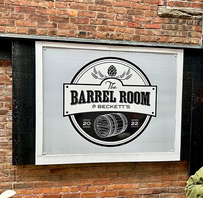 The Barrel Room sign announces itself with the quiet confidence of a place that knows exactly what it's about—good drinks and great times.