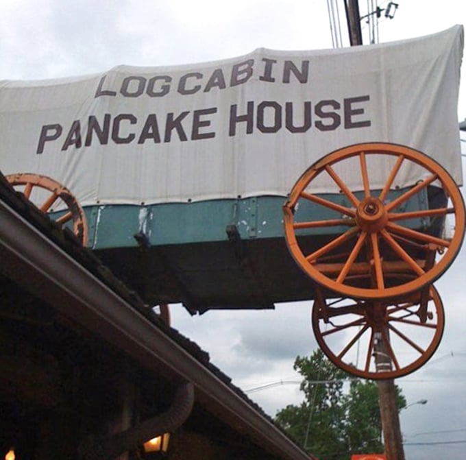 That wagon wheel isn't just for show—it's spinning tales of breakfast legends that have unfolded beneath this iconic sign.
