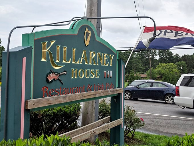 The roadside sign stands as a beacon for hungry travelers – like a lighthouse, but guiding you to fish and chips instead of safe harbor.