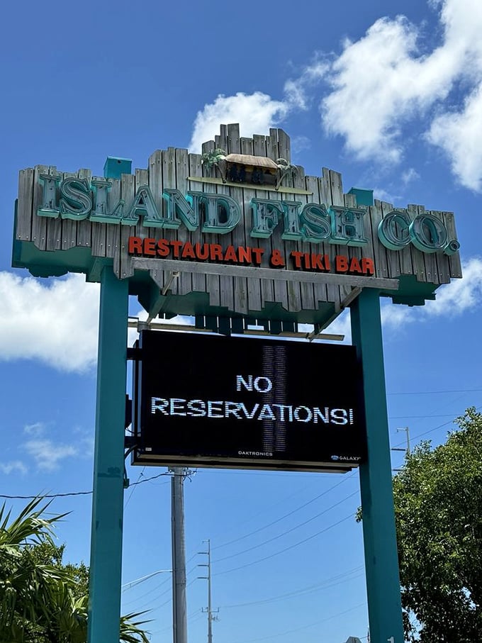 The sign says "NO RESERVATIONS!"—which might be the most honest restaurant signage in Florida. Worth the wait every time. 