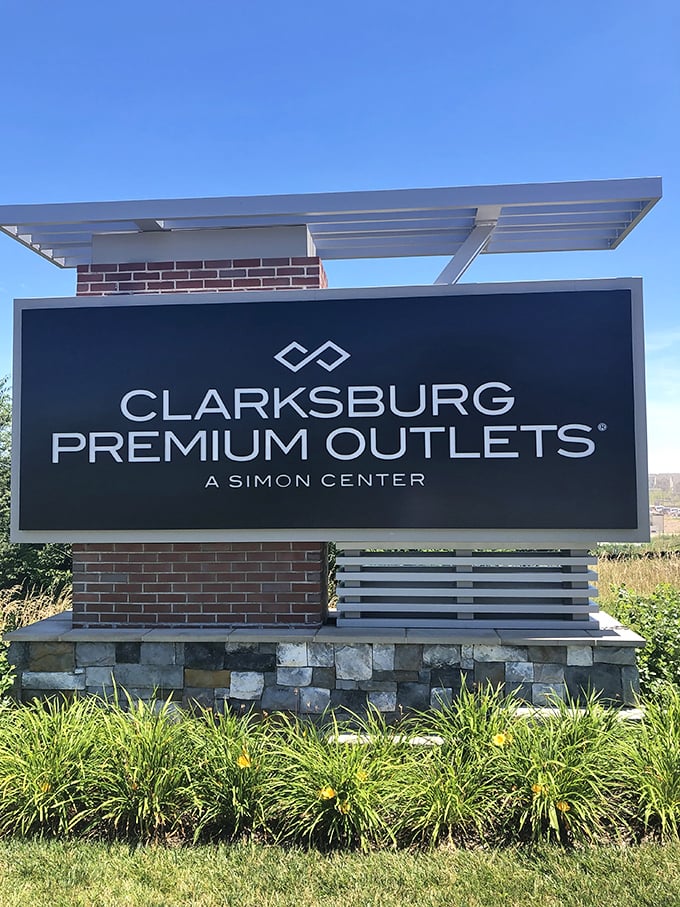 The official welcome sign stands proud, like a retail version of the Hollywood sign, beckoning bargain hunters from miles around.
