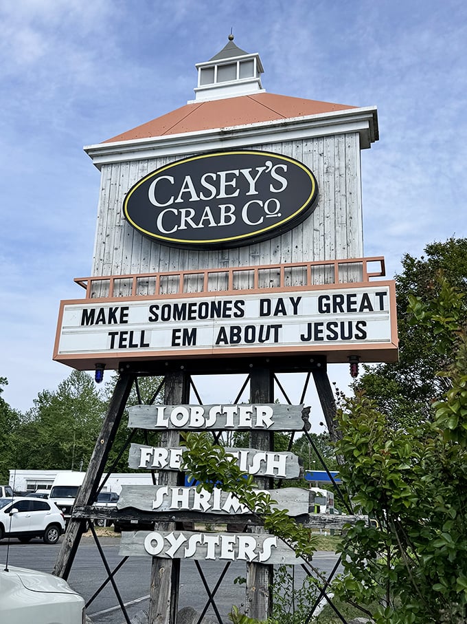 The roadside sign combines seafood and spirituality—only in Maryland would lobster and Jesus share billboard space in perfect harmony.