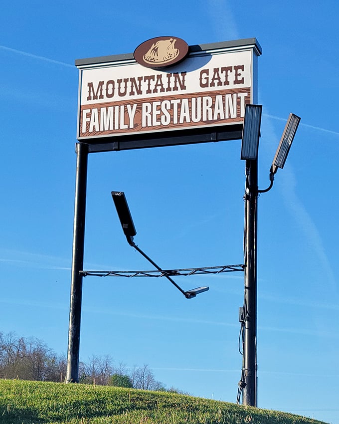 The roadside sign stands as a beacon of hope for hungry travelers—like a lighthouse, but instead of avoiding rocks, you're steering toward rolls.