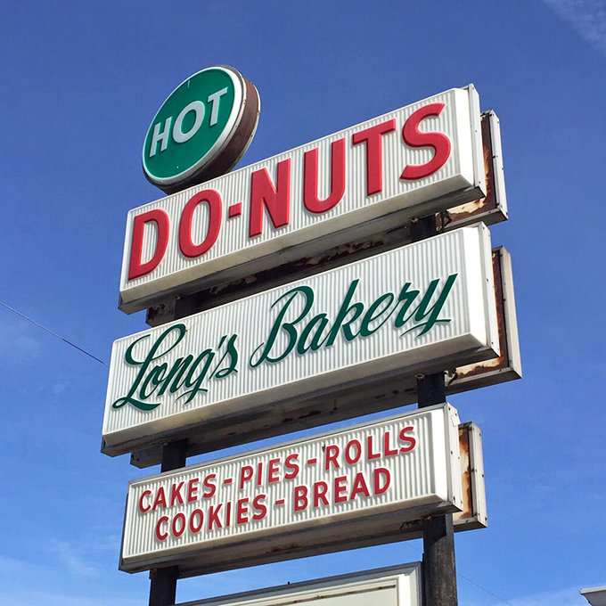 A sign that's become more than directions—it's a beacon of hope for the hungry. "HOT DO-NUTS" might be the two most beautiful words in English.