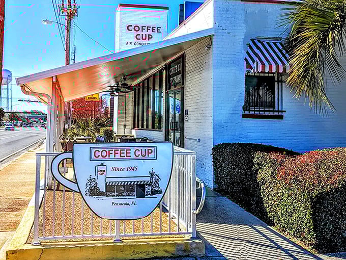 Not just a sign, but a beacon of breakfast hope – the Coffee Cup's iconic cup-shaped marquee has been guiding hungry Floridians home since 1945.
