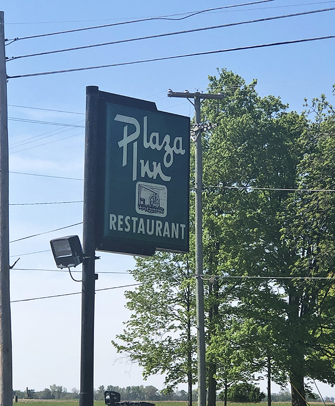 The roadside sign stands as a beacon for hungry travelers—a green promise of homestyle cooking that's been fulfilled for generations.