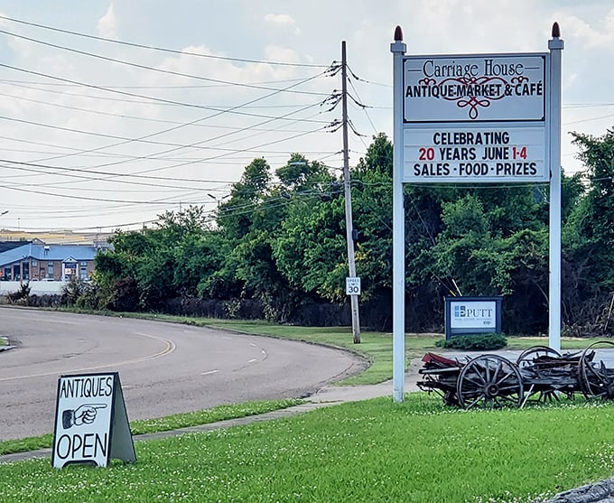 The roadside sign stands as a beacon to passing travelers – promising antiques, food, and the thrill of the hunt just off the highway in Jackson.