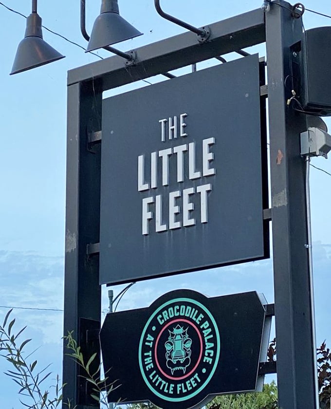 That sign isn't just marking a location—it's a beacon for food lovers, promising culinary adventure behind its unassuming exterior.