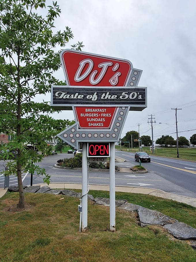 That sign isn't just announcing a restaurant—it's broadcasting a time machine. Classic arrow design pointing directly to your next food adventure.