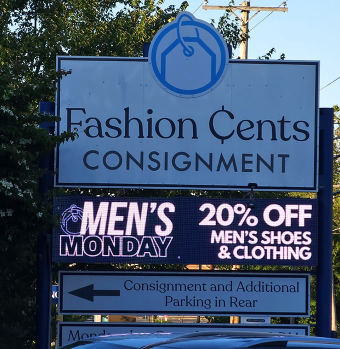The roadside sign announces "Men's Monday" discounts—proof that Fashion Cents understands even reluctant shoppers need a little extra incentive.