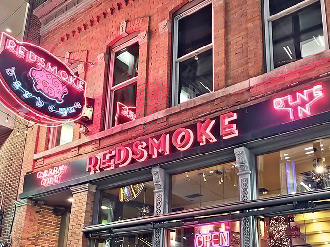 At night, Redsmoke's neon glow transforms from "restaurant sign" to "urban landmark" that whispers sweet, smoky promises to passersby.