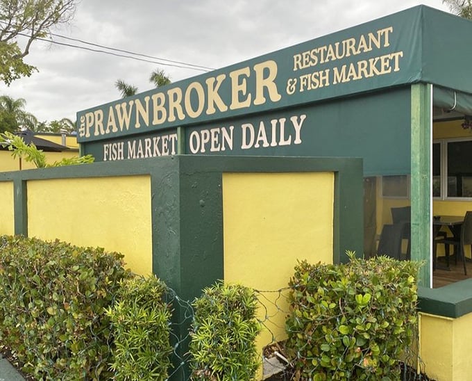 The sign promises two treasures in one stop: a restaurant AND a fish market. Like finding a library with a chocolate shop inside – double the pleasure.