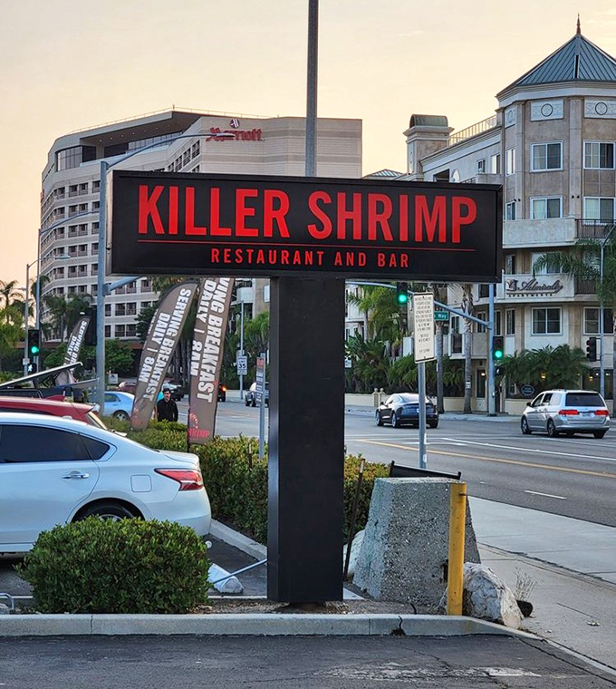 The bold red signage stands like a beacon for hungry travelers—less "Here be dragons" and more "Here be delicious shrimp."