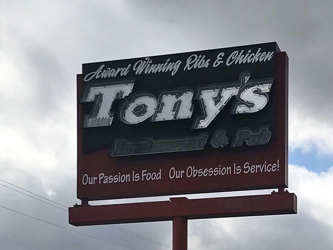 "Our Passion Is Food, Our Obsession Is Service!" The sign says it all—Tony's isn't just selling meals, they're delivering experiences worth remembering.