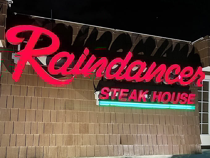 The iconic Raindancer sign beckoning hungry travelers like a neon lighthouse guiding ships to their delicious destiny.