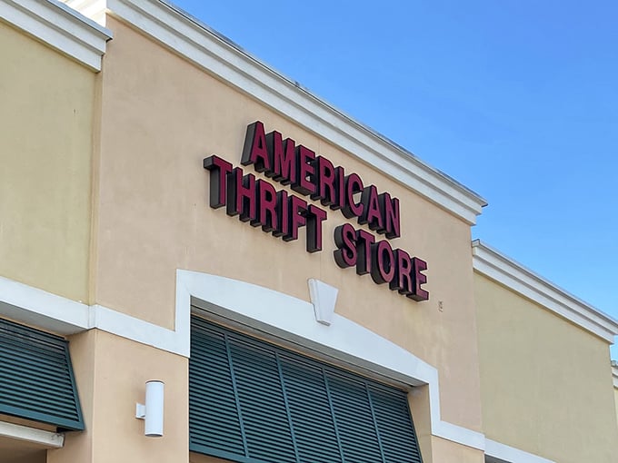 The sign beckons against the Florida sky like a beacon for bargain hunters. No treasure map needed—just follow the red letters.