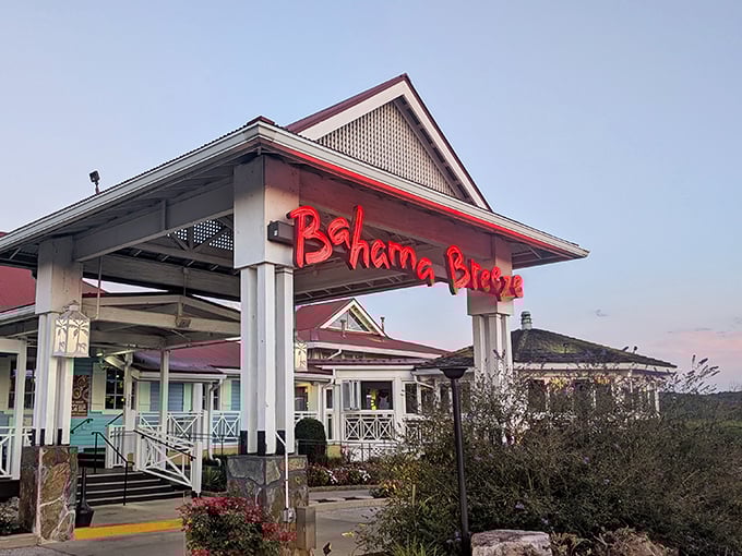 As day turns to dusk, the Bahama Breeze sign glows like a beacon of tropical promise against the Pennsylvania sky.