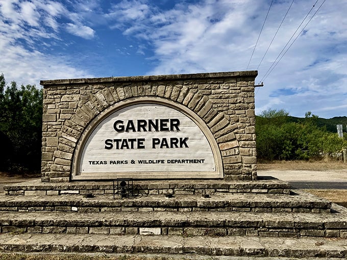 The iconic stone entrance sign—where more family photos have been taken than at most wedding venues across the state.