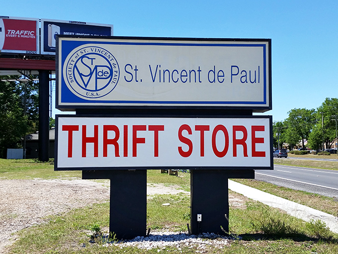 The sign stands proud along the roadside, a beacon for bargain hunters and philanthropists alike—two birds, one very affordable stone.
