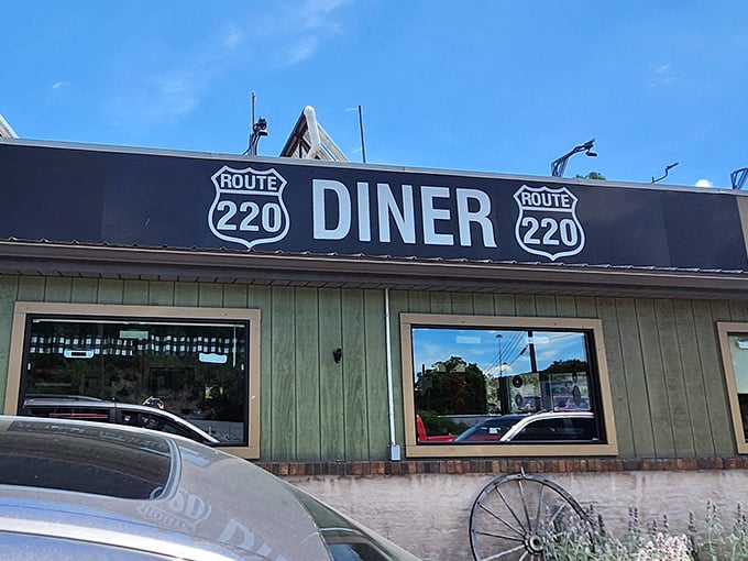 Even under blue skies, Route 220 Diner's sign stands out—a landmark for locals and a discovery waiting to happen for everyone else.