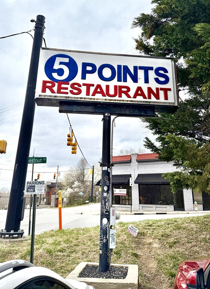 The iconic Five Points sign stands as a beacon for hungry travelers and locals alike—a North Carolina landmark that promises honest food without pretension.
