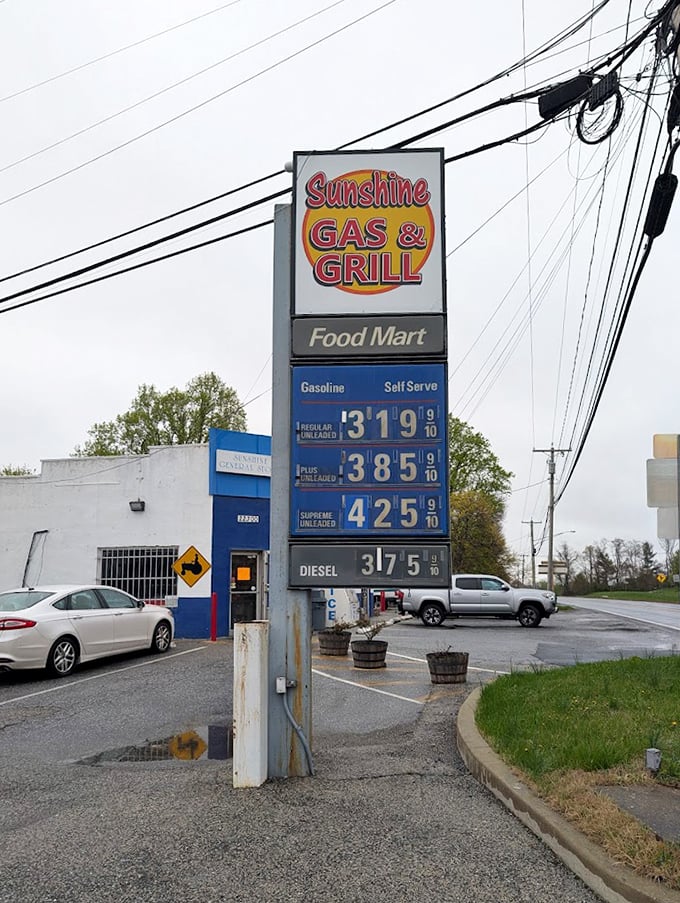 The roadside sign announces "Sunshine Gas & Grill"—a humble declaration that hides the extraordinary burger experience waiting inside.