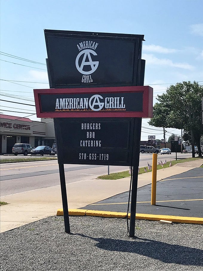 The roadside sign stands tall, a beacon of BBQ hope for hungry travelers. Simple, straightforward, and promising exactly what you need – great food without pretense.