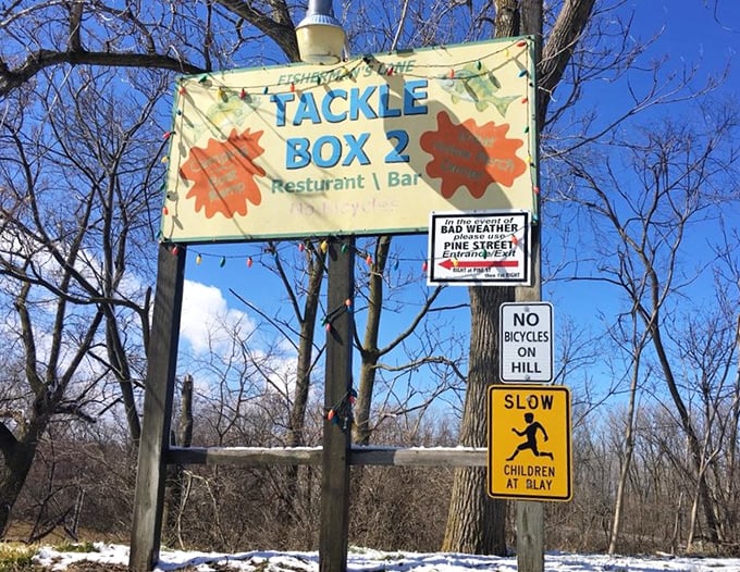 The sign says it all—"Fisherman's Cove" at Tackle Box 2. Like all great roadside treasures, if you blink, you might miss the turn to paradise.