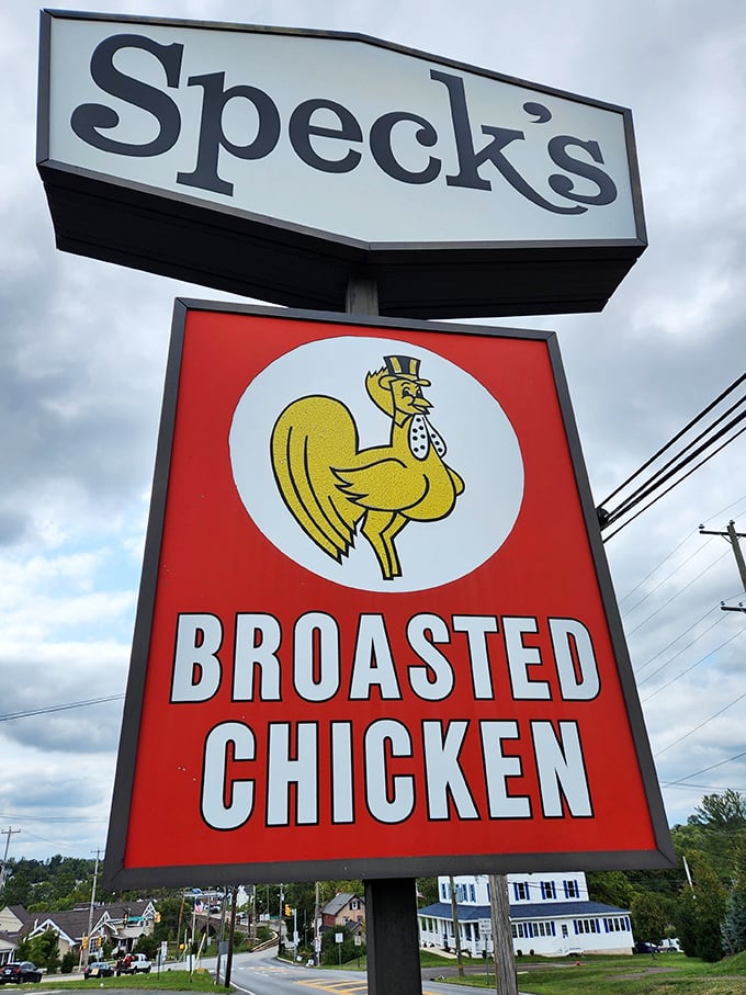 That sign says everything you need to know—a dapper chicken in a top hat promising broasted perfection. No false advertising here.
