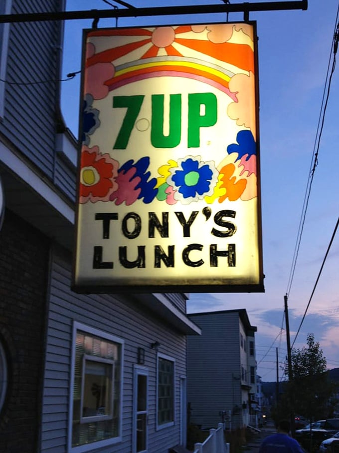 This psychedelic 7UP sign has witnessed decades of food pilgrimages. Retro design, timeless appeal—just like everything served inside.