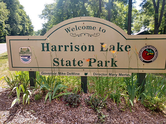 The gateway to adventure! This welcoming sign promises memories that will outlast your sunburn and mosquito bites.