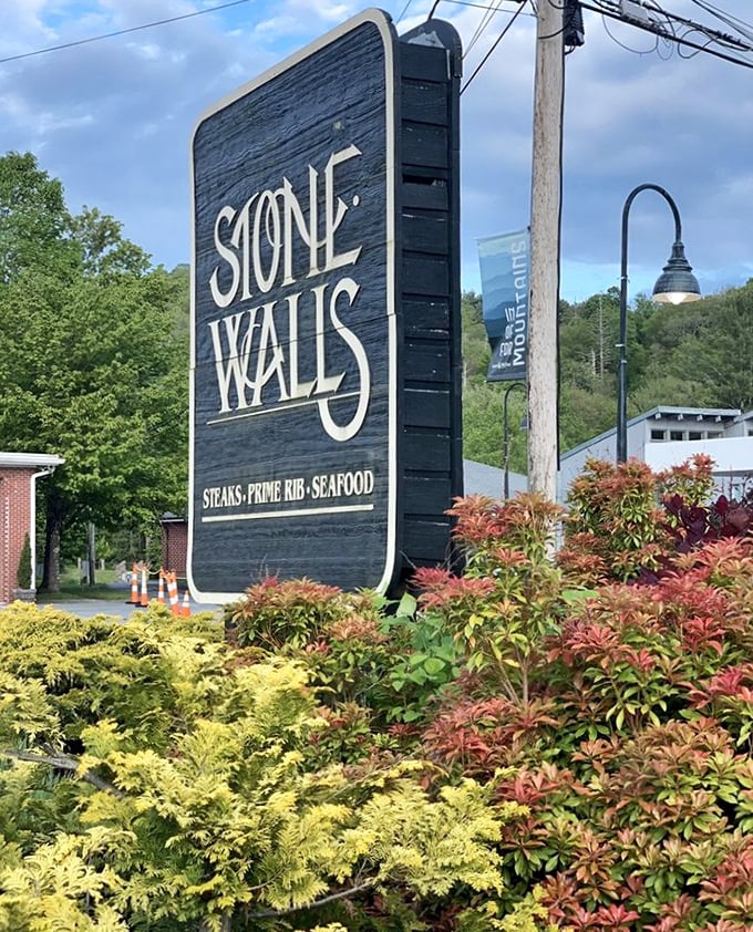 The roadside sign stands as a beacon for hungry travelers—"Steaks, Prime Rib, Seafood" might be the three most beautiful words in the English language.