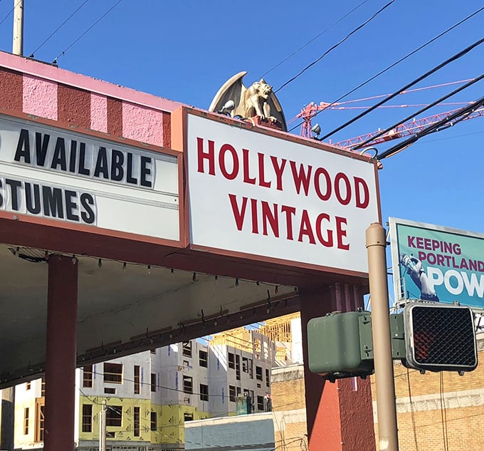Look up! A gargoyle perches atop the Hollywood Vintage sign, guarding decades of fashion history below. Portland's keeper of cool.