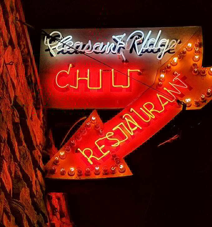 When this neon sign glows against the night sky, it's not just advertising—it's a beacon of hope for empty stomachs everywhere.
