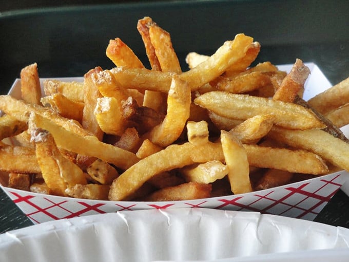 These golden, skin-on fries aren't just a side dish—they're the supporting actors that deserve their own Oscar in the drama of a perfect lunch.
