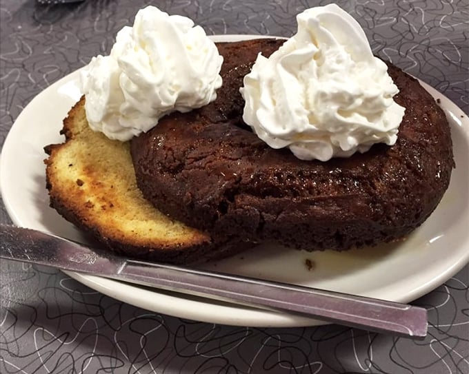 A chocolate dessert with twin peaks of whipped cream that doesn't care about your diet plans—it's here to remind you that life is short and sweet.