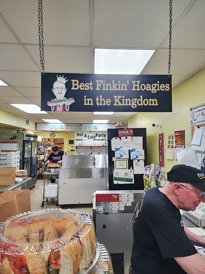Under the watchful gaze of the "Best Finkin' Hoagies" sign, sandwich artisans work their magic in a space where every square inch is dedicated to the pursuit of perfection.