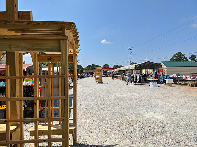 The market's sprawling layout invites exploration under clear blue skies, where covered stalls and open-air vendors create a village dedicated to the art of the deal.