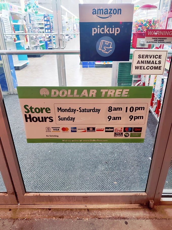 Even the store hours sign reveals modern conveniences—Amazon pickup and service animals welcome at this thoroughly 21st-century dollar store.