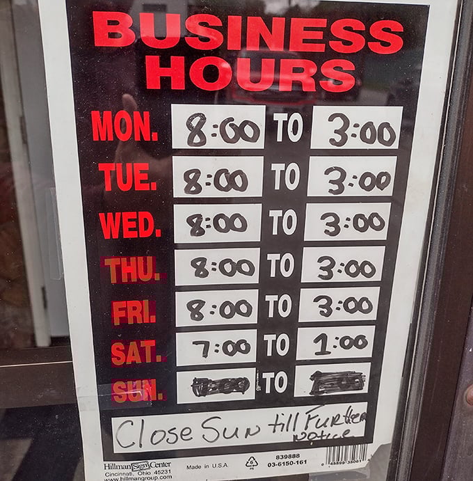 Hours posted like a promise – they'll be here when you need them, Sunday closure and all.