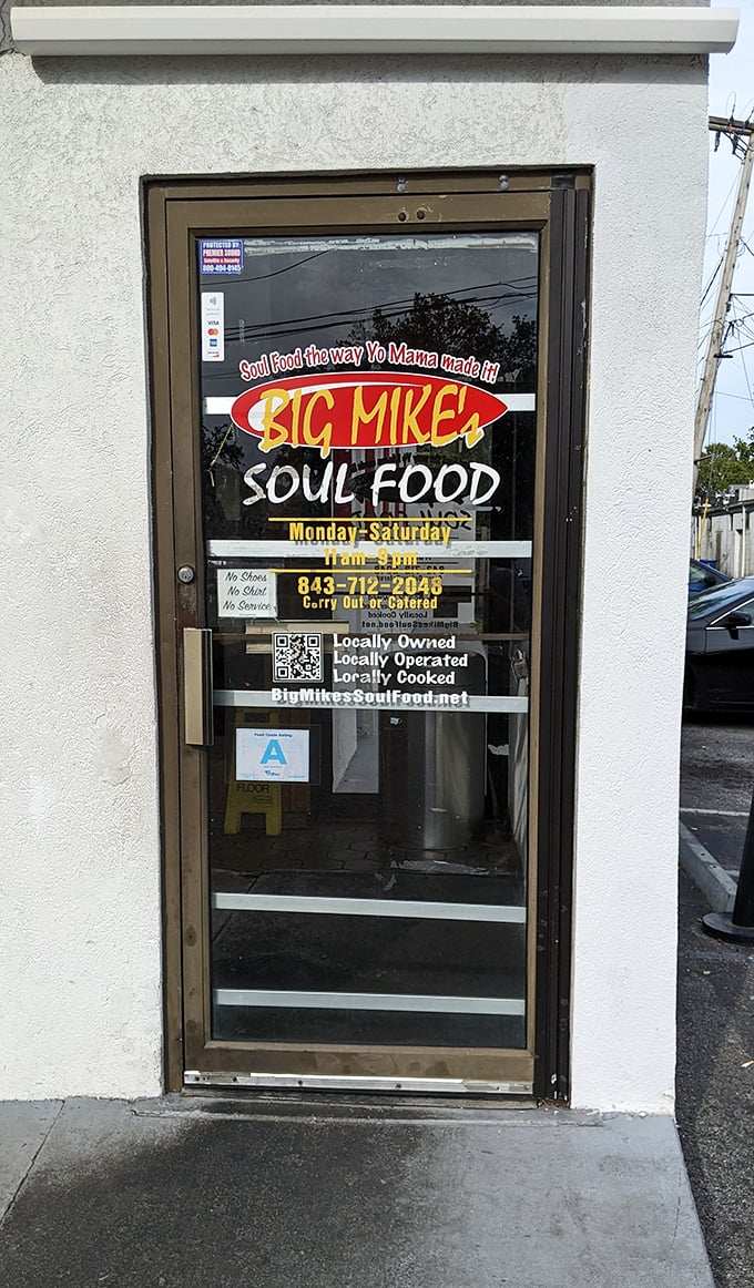 The entrance door with hours posted – the portal to flavor town, operating Monday through Saturday, with a phone number that should be on your speed dial.